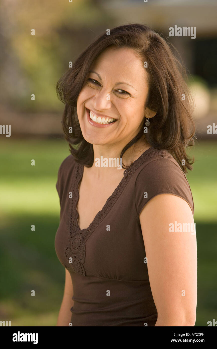 Hispanic woman laughing Stock Photo - Alamy