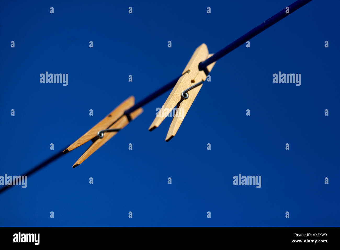 Wooden clothes pegs on a washing line Stock Photo - Alamy