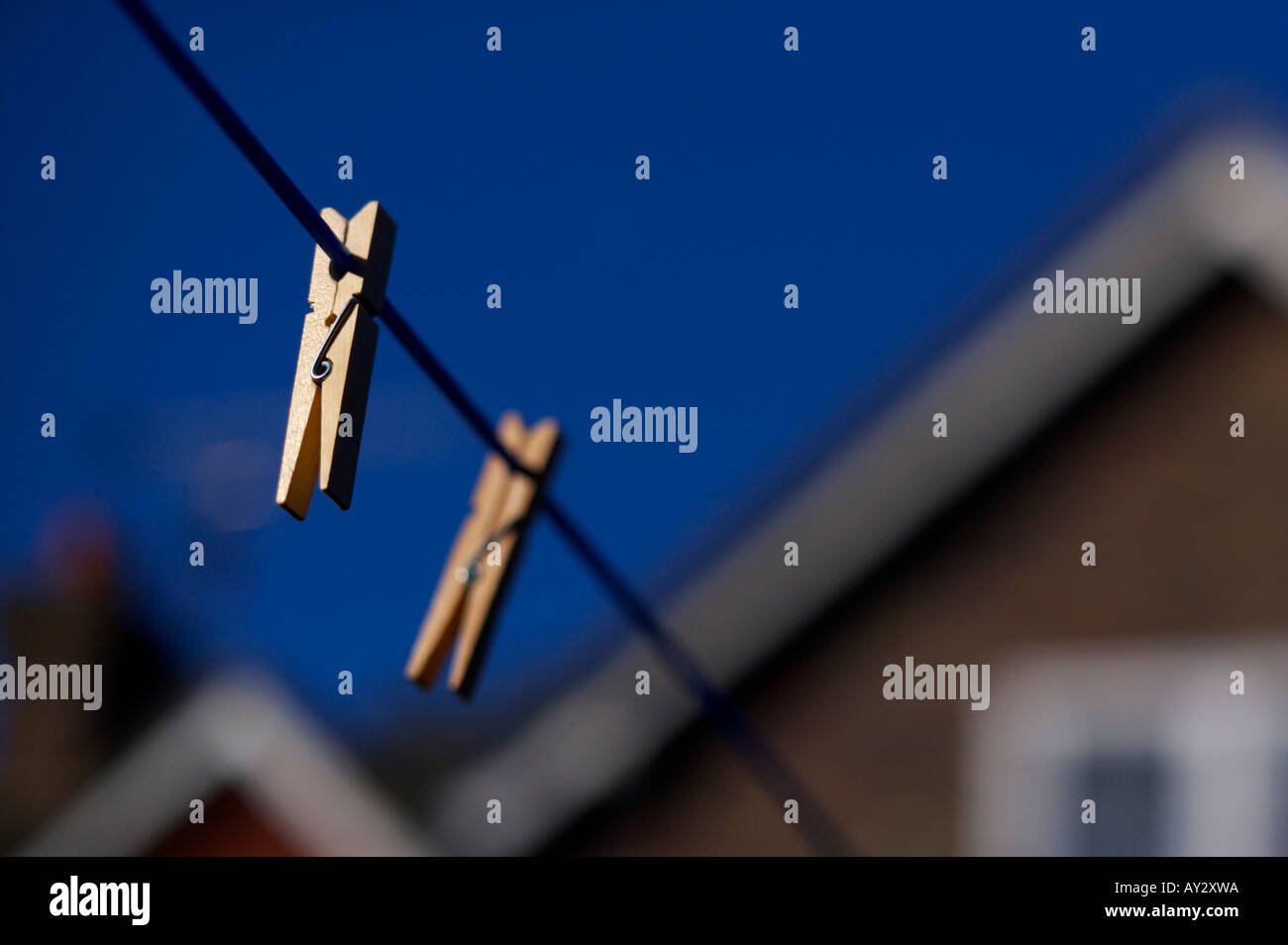 Wooden clothes pegs on a washing line Stock Photo - Alamy