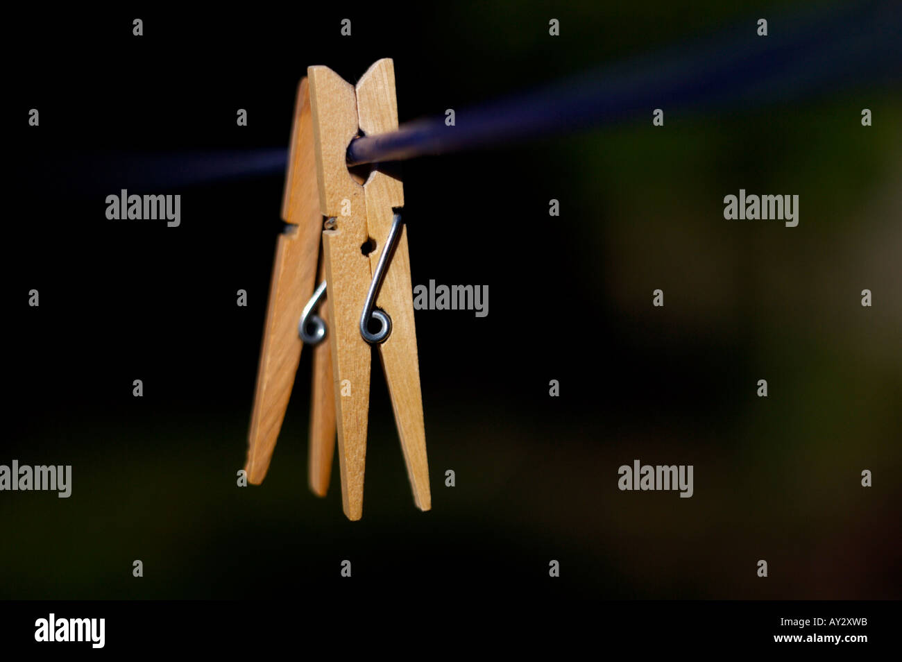 Wooden clothes pegs on a washing line Stock Photo - Alamy