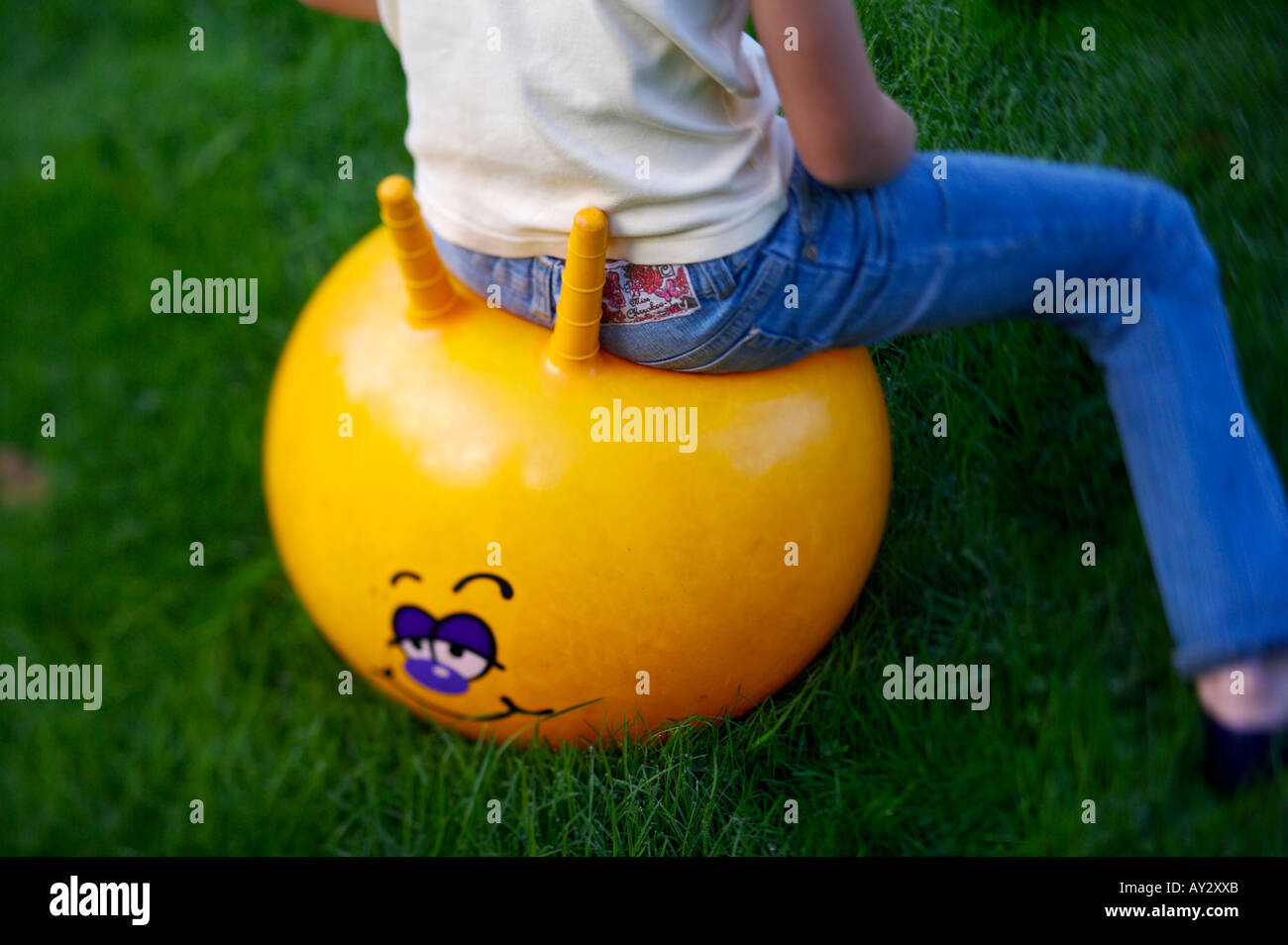 Child on a spacehopper toy Stock Photo - Alamy