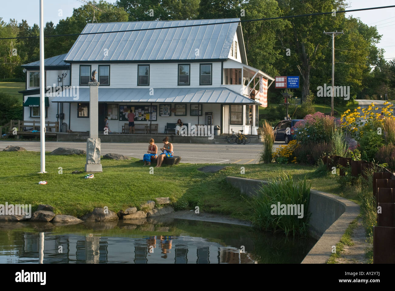 Adults and teenage girls enjoying the late afternoon outside of the ...