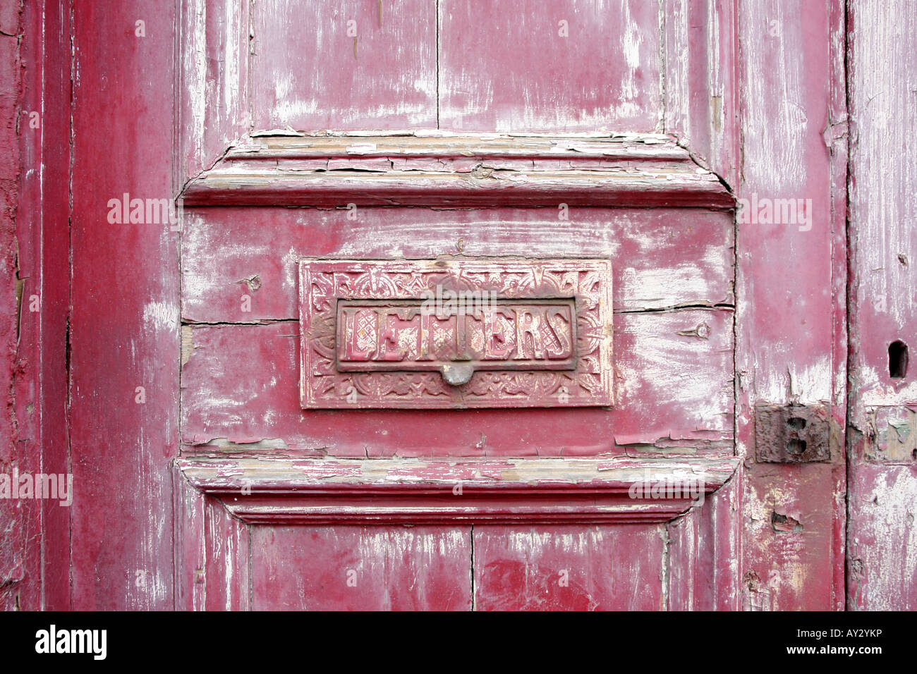 Old letter box on a red door with weathered faded paint Stock Photo - Alamy
