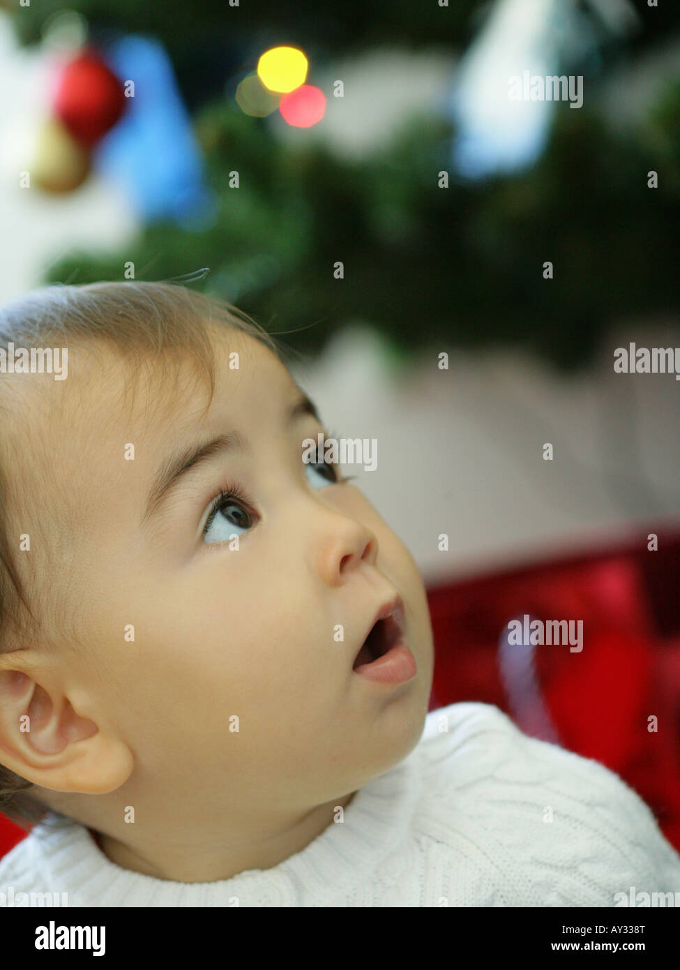 Close-up of a baby girl looking up Stock Photo - Alamy