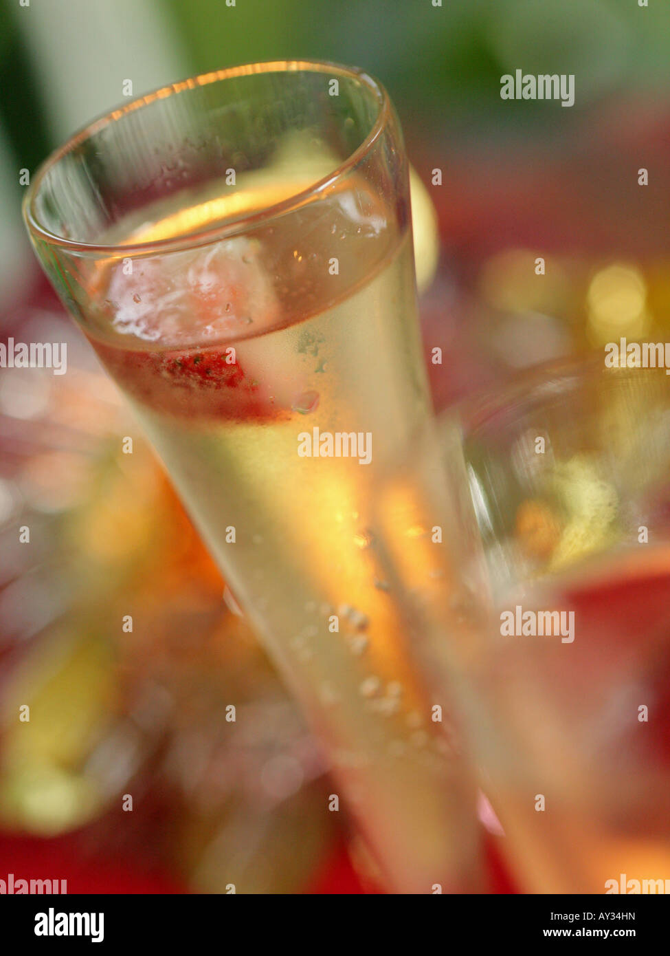 Close-up of a strawberry floating in a champagne flute Stock Photo - Alamy