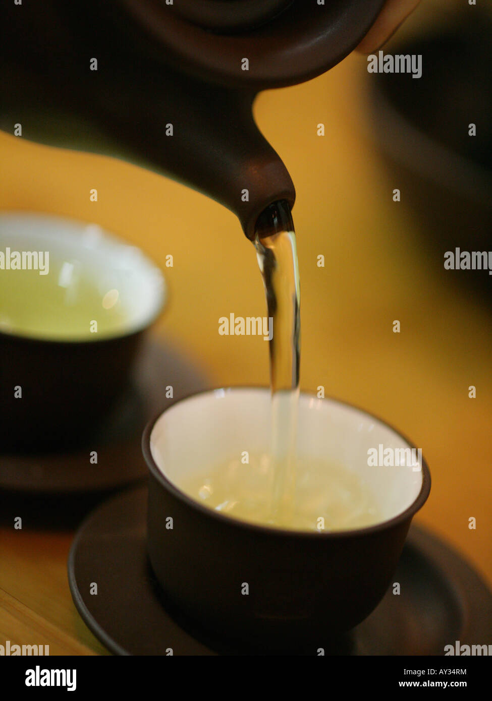 Tea being poured into a tea cup hi-res stock photography and images - Alamy