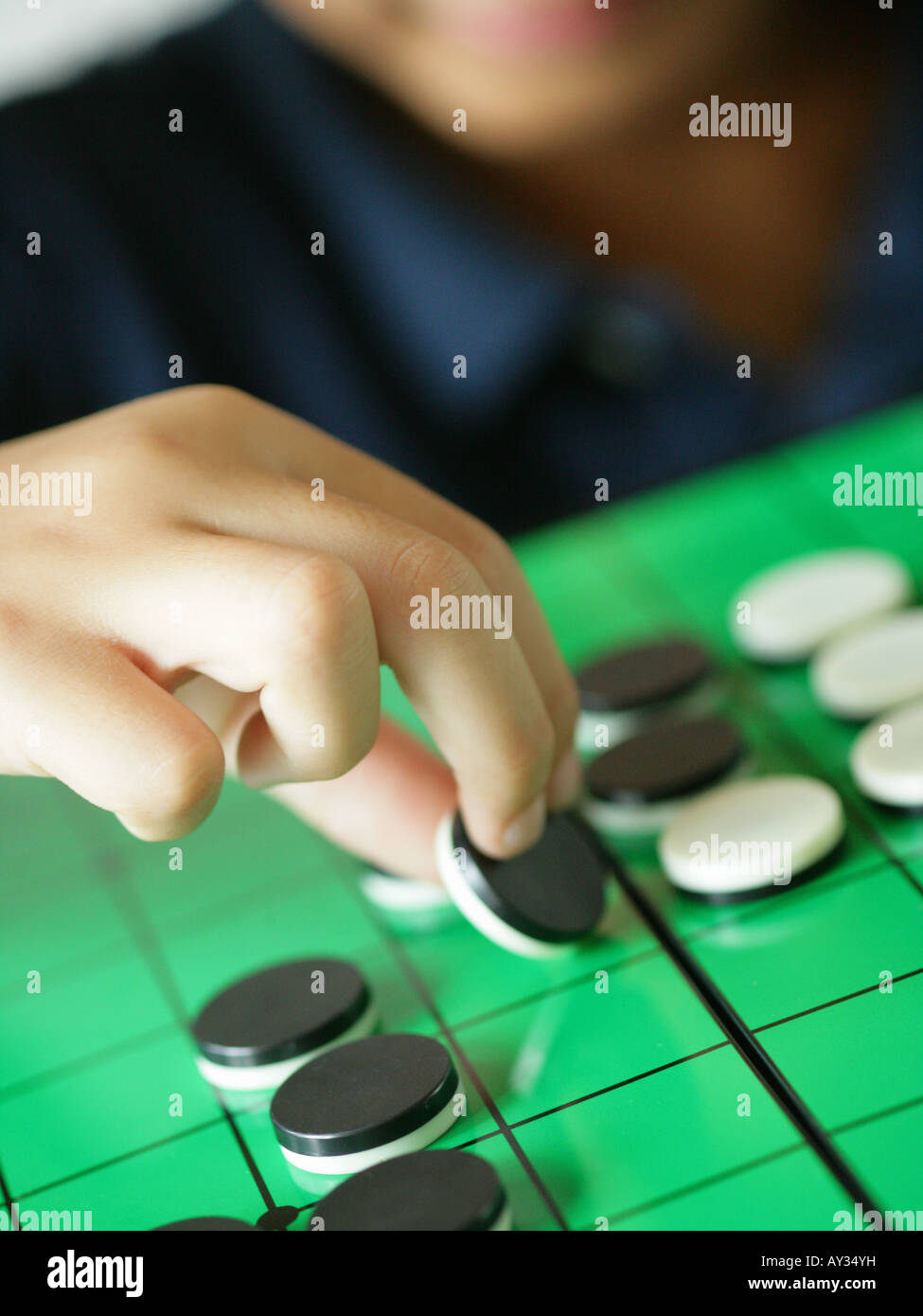 Close-up of a person's hand holding a board game piece Stock Photo - Alamy