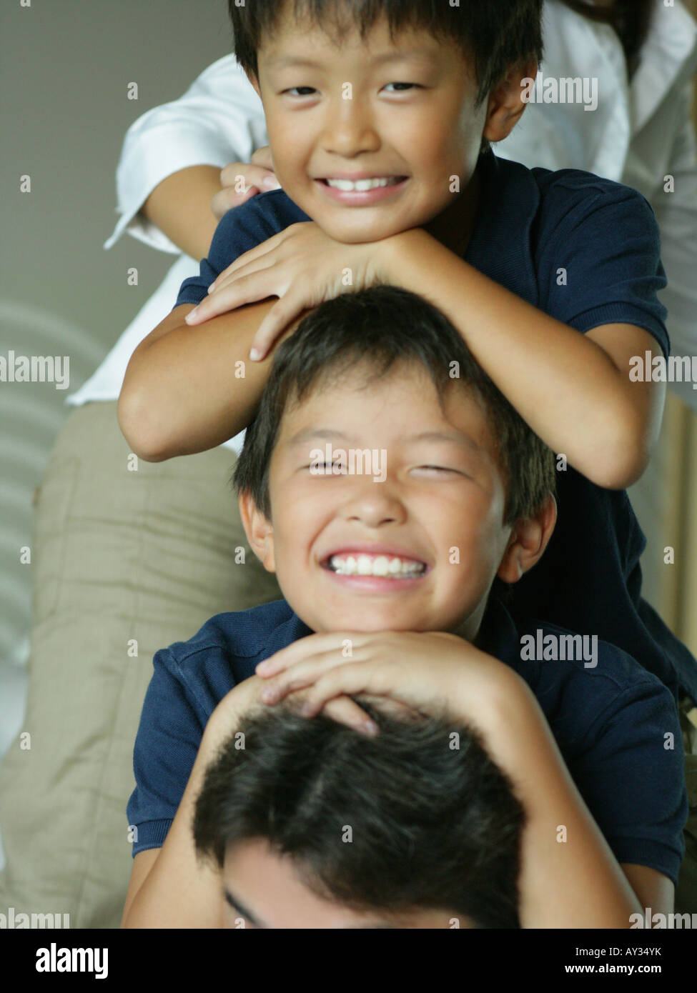 Mid adult couple and their two children in a row Stock Photo - Alamy