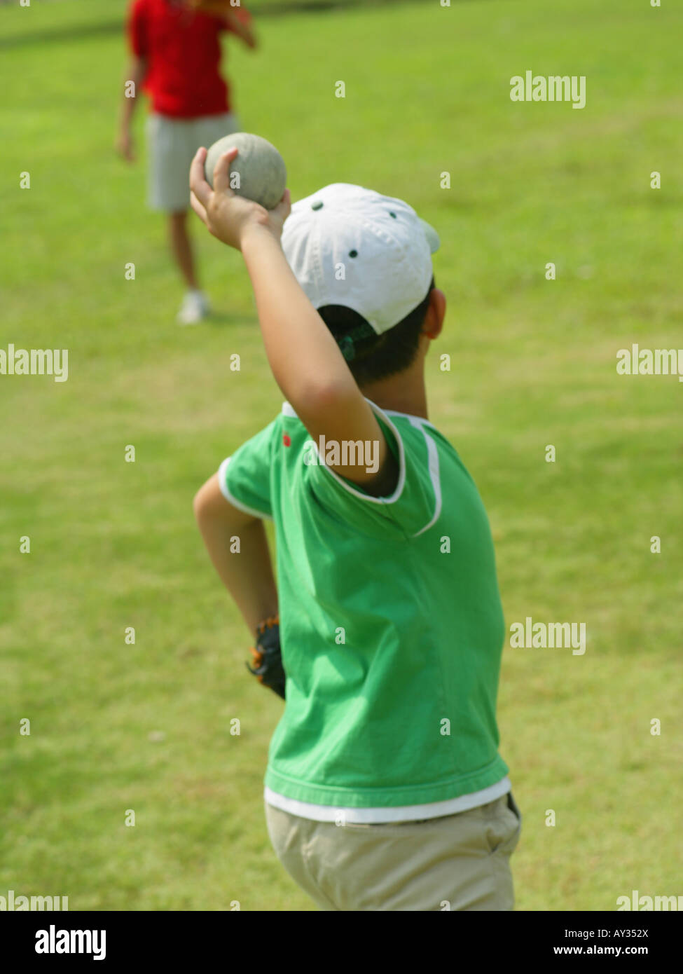 Two boys playing baseball catch hi-res stock photography and images - Alamy