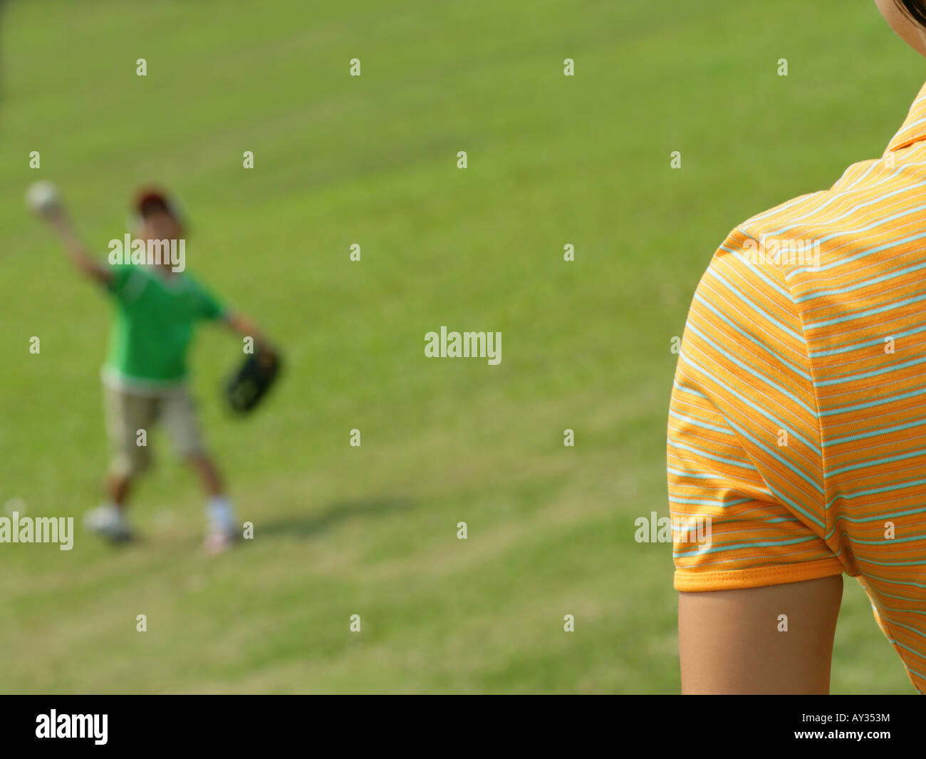 Boy playing catch with his mother Stock Photo - Alamy