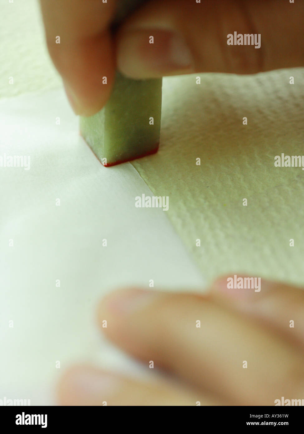 Close up persons hand using stamp hi-res stock photography and images ...