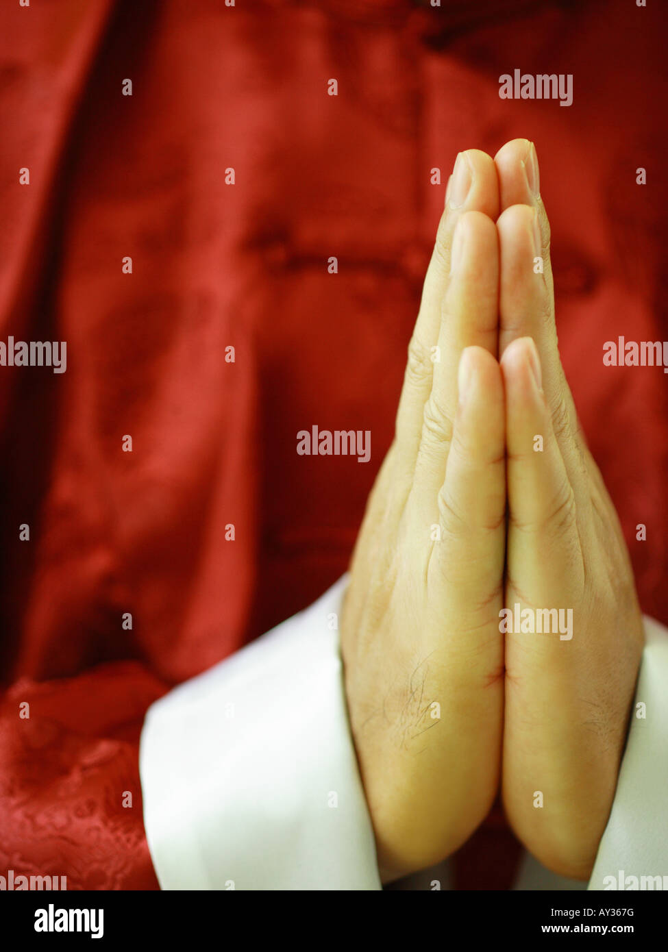 Mid section view of a man in a prayer position Stock Photo - Alamy