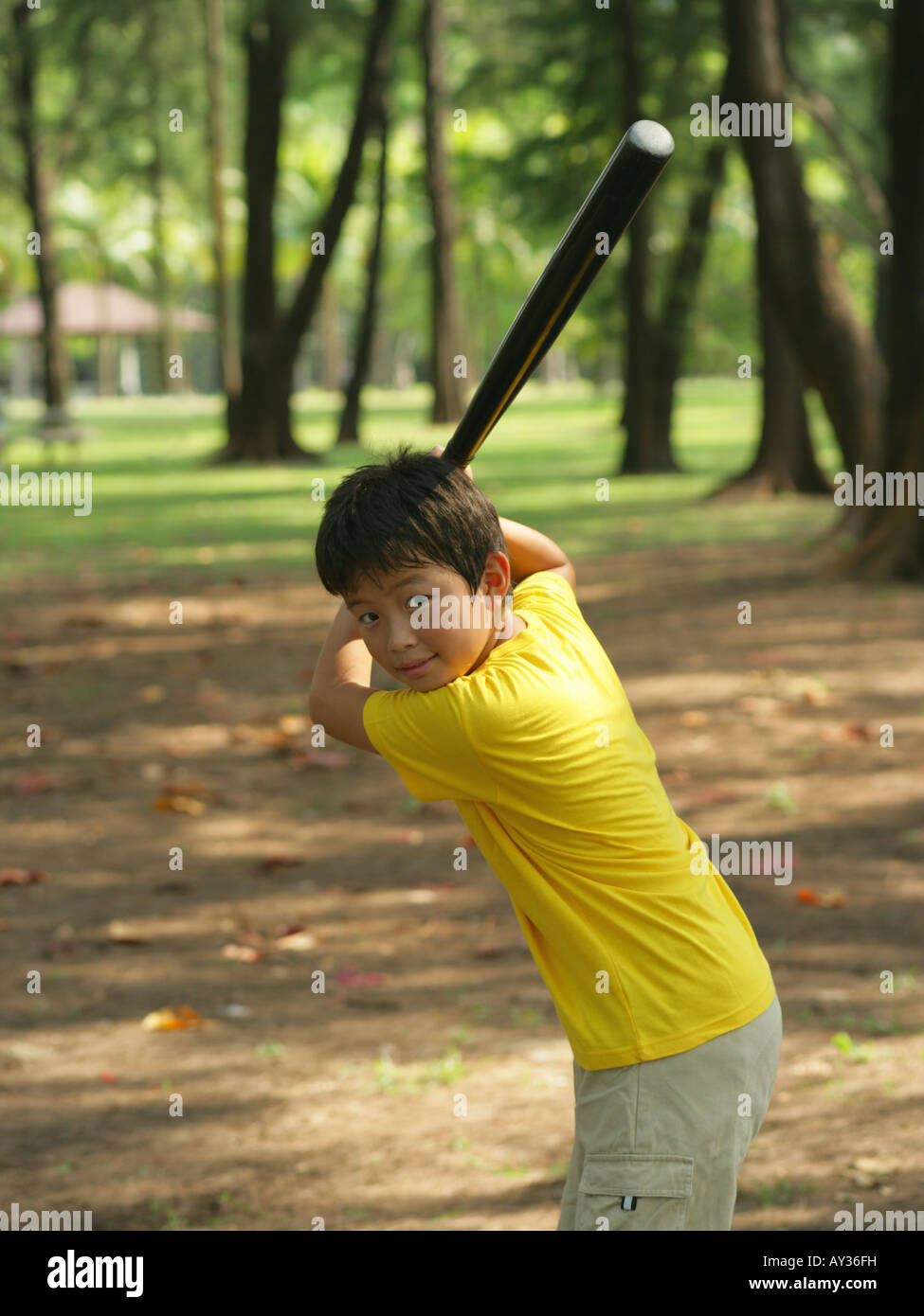 Boy with a baseball bat hi-res stock photography and images - Alamy
