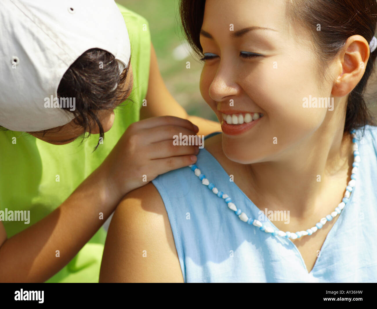 Women hand around neck hi-res stock photography and images - Alamy