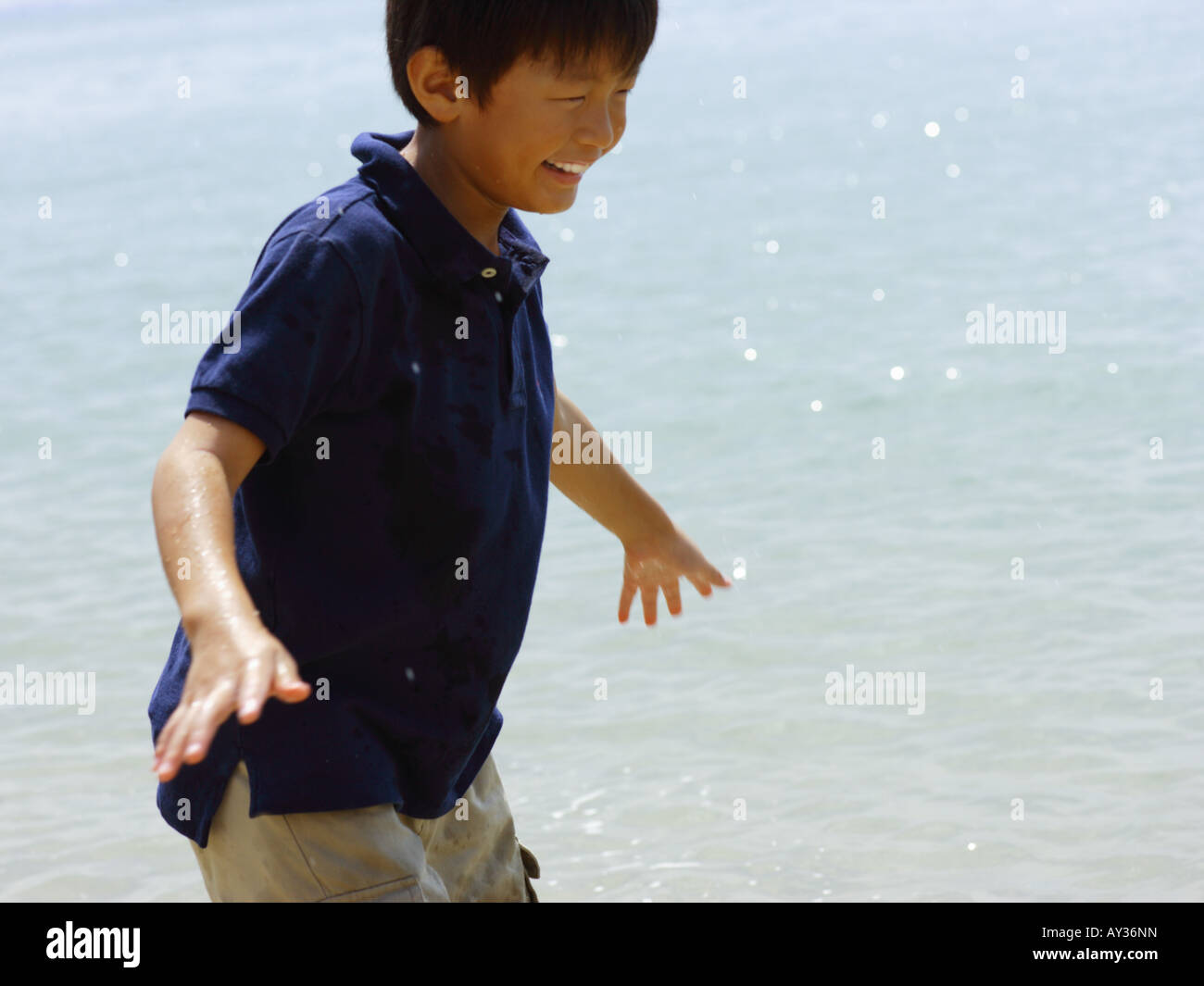 Side profile of a boy smiling Stock Photo - Alamy