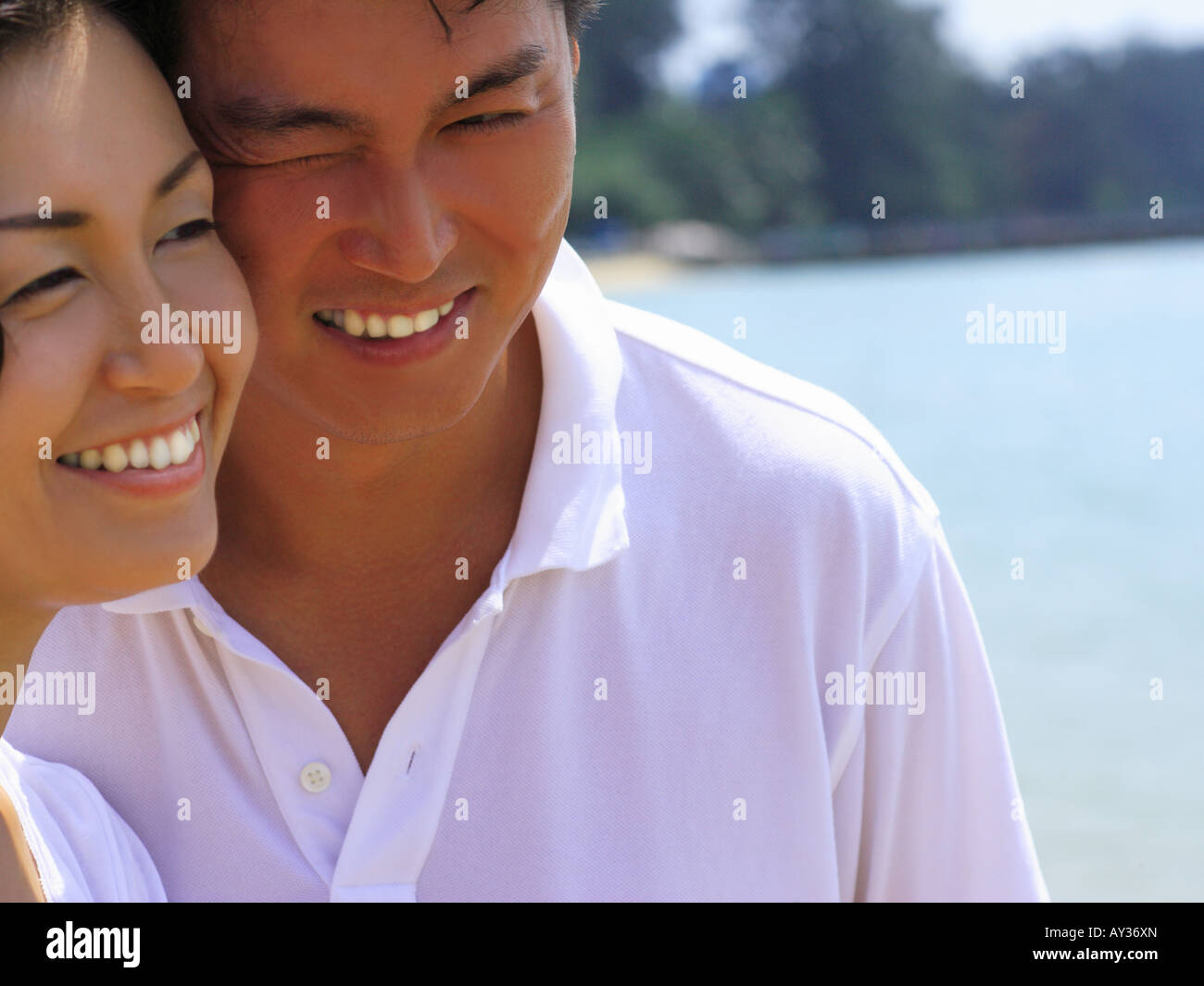 Close-up of a mid adult couple smiling Stock Photo - Alamy