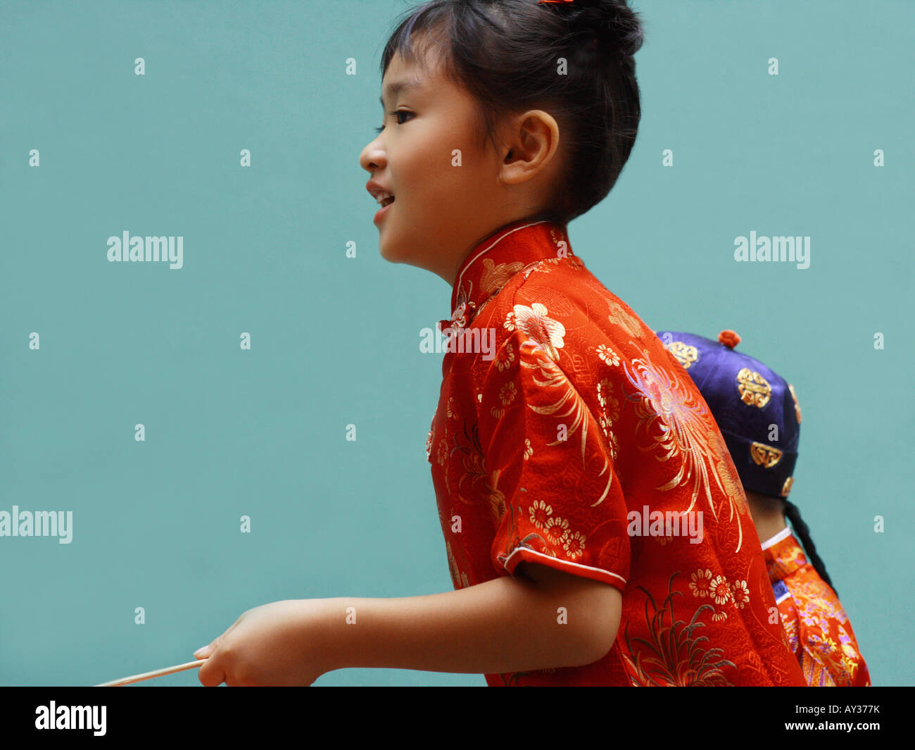 Side profile of a girl smiling with a child Stock Photo - Alamy
