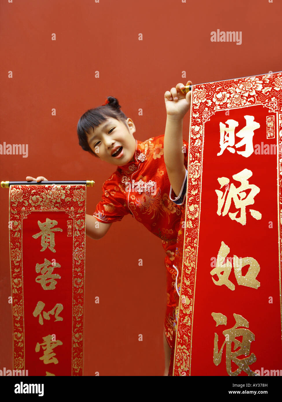 Portrait of a girl holding a banner Stock Photo - Alamy