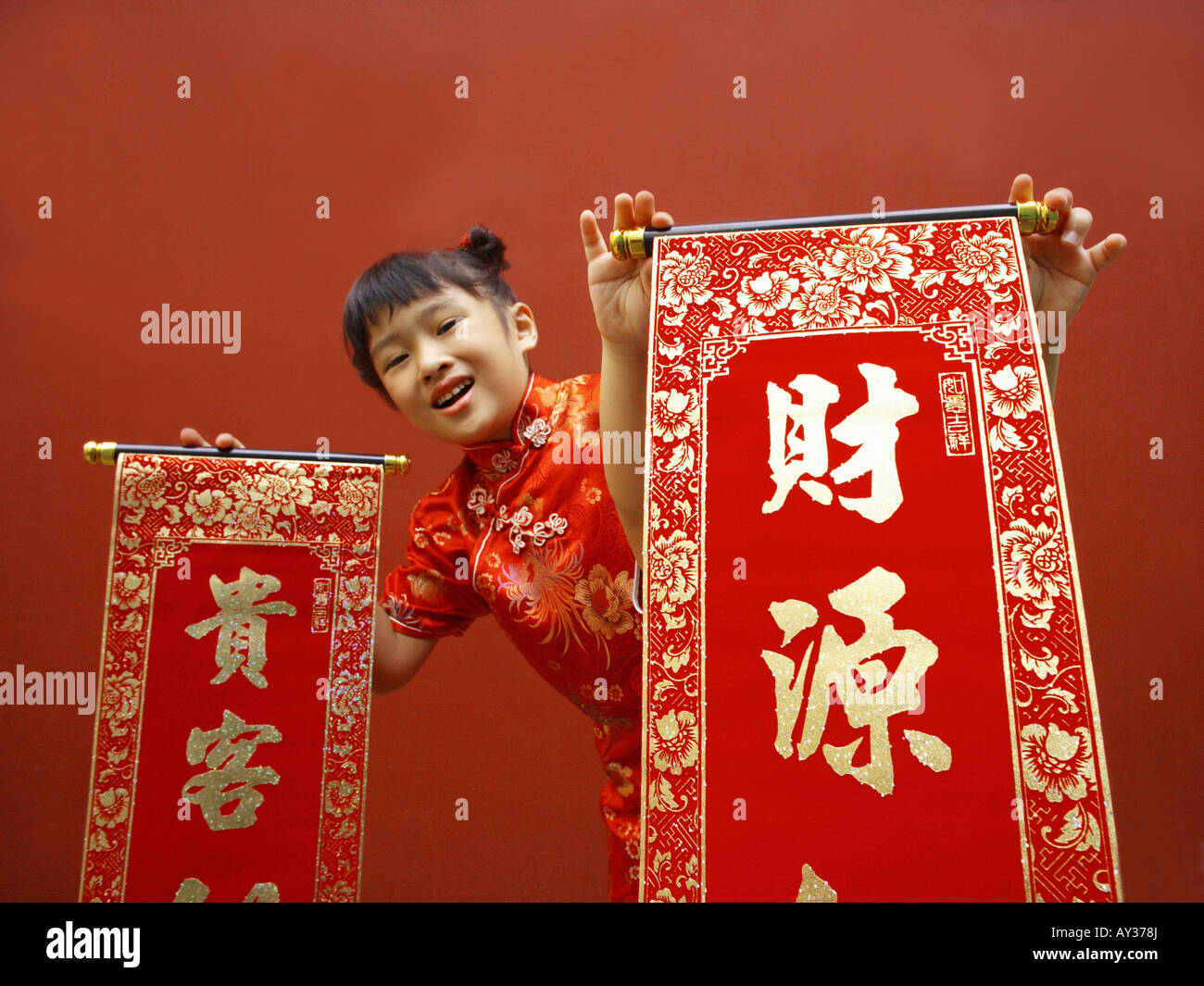 Portrait of a girl holding a banner Stock Photo - Alamy