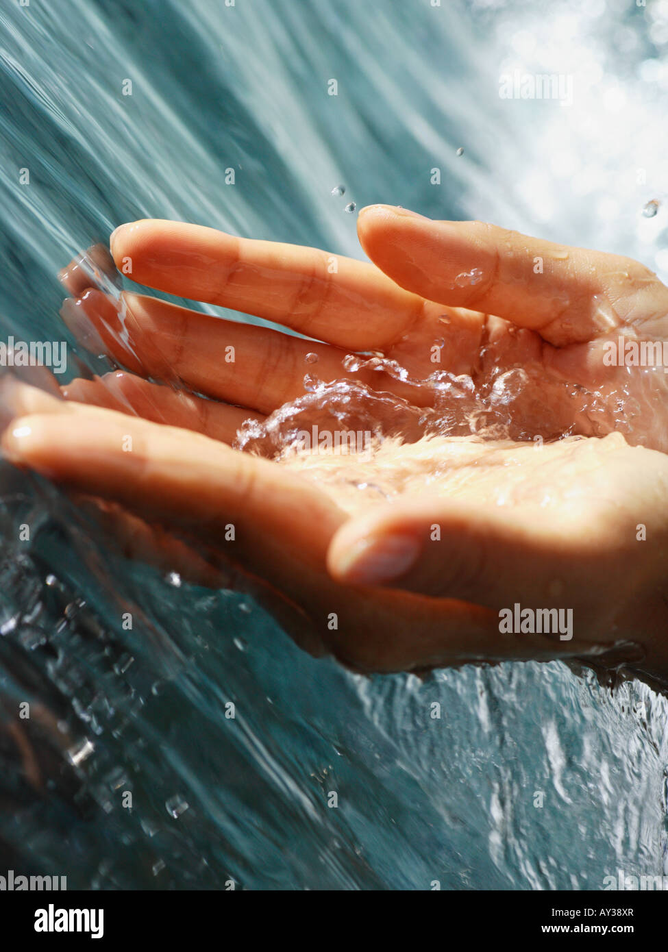 Close-up of a person's hands cupped in water Stock Photo - Alamy