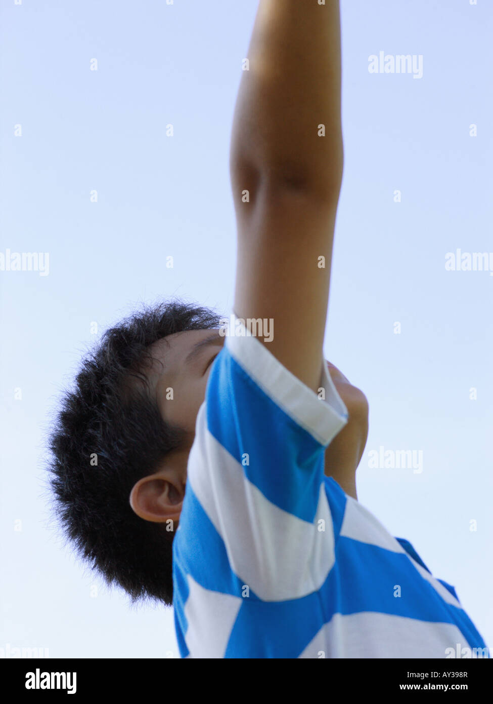 Side profile boy hand raised hi-res stock photography and images - Alamy