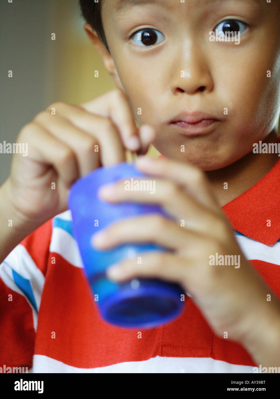 Portrait of a boy eating egg pudding Stock Photo - Alamy