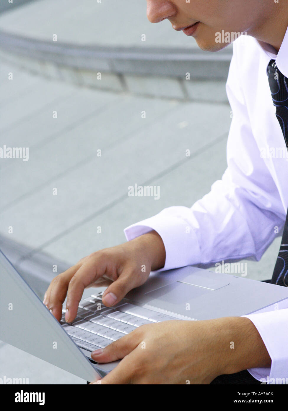 Side profile of a businessman using a laptop Stock Photo - Alamy