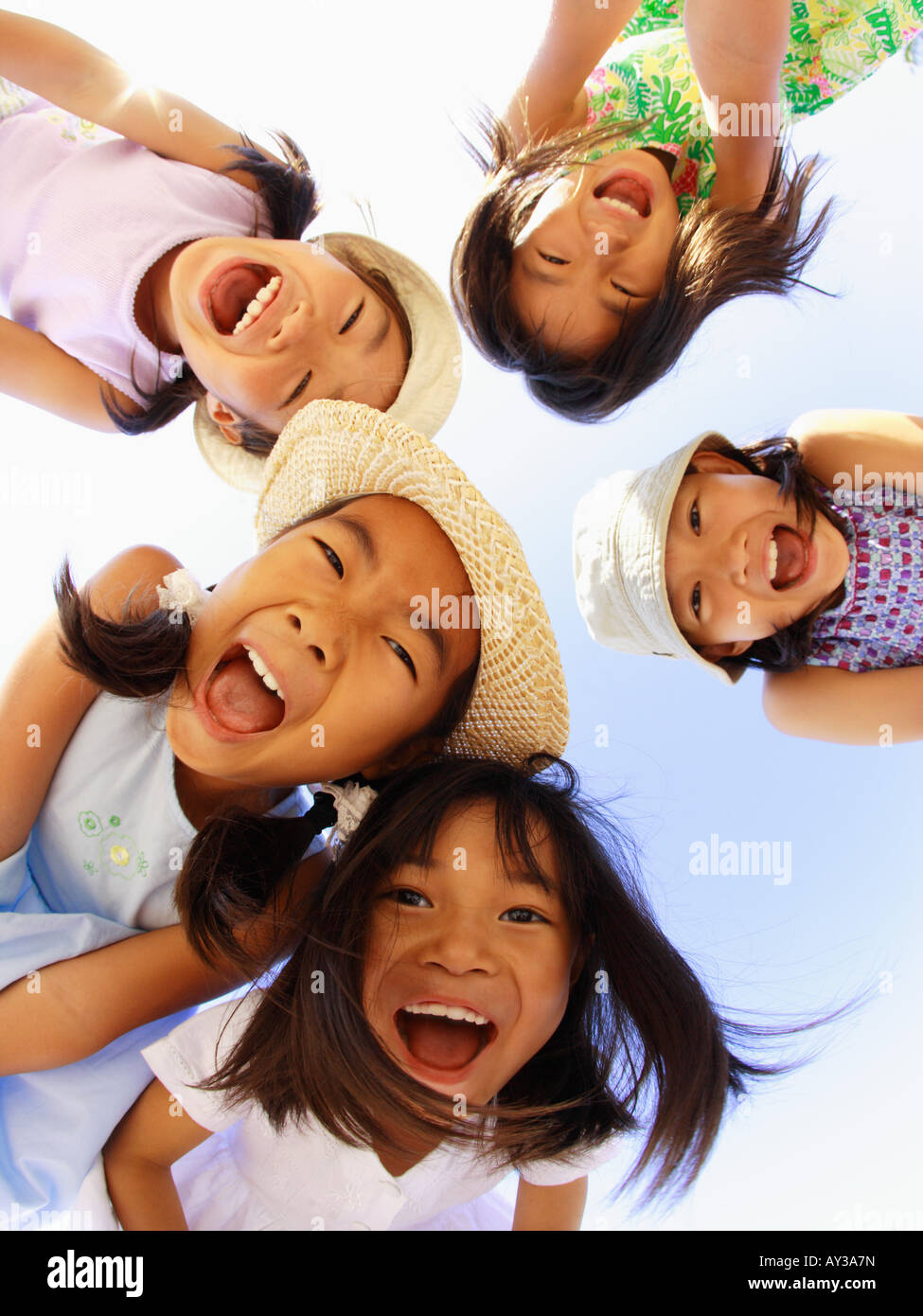 Portrait of five girls standing in a huddle and smiling Stock Photo - Alamy