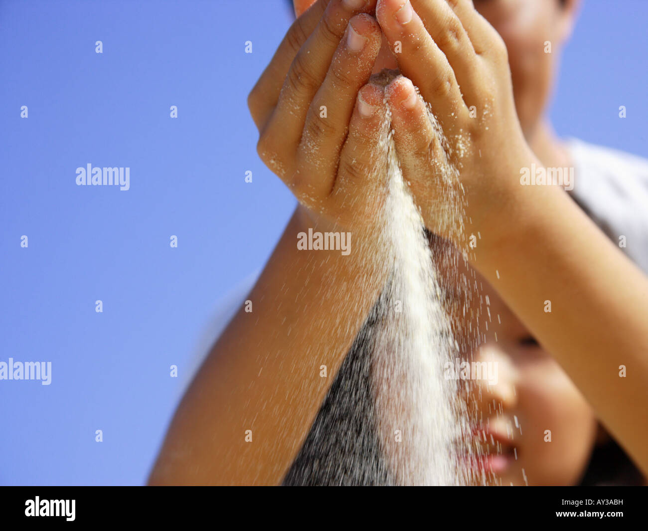 Two girls playing sand hi-res stock photography and images - Alamy