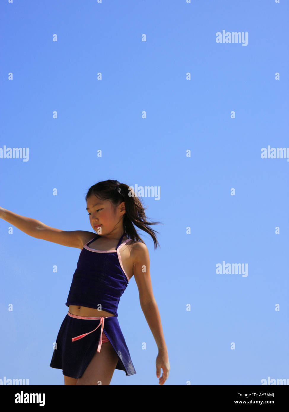 Low angle view of a girl standing Stock Photo - Alamy