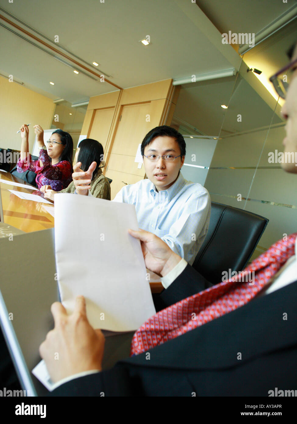 Four business executives in a conference room Stock Photo - Alamy