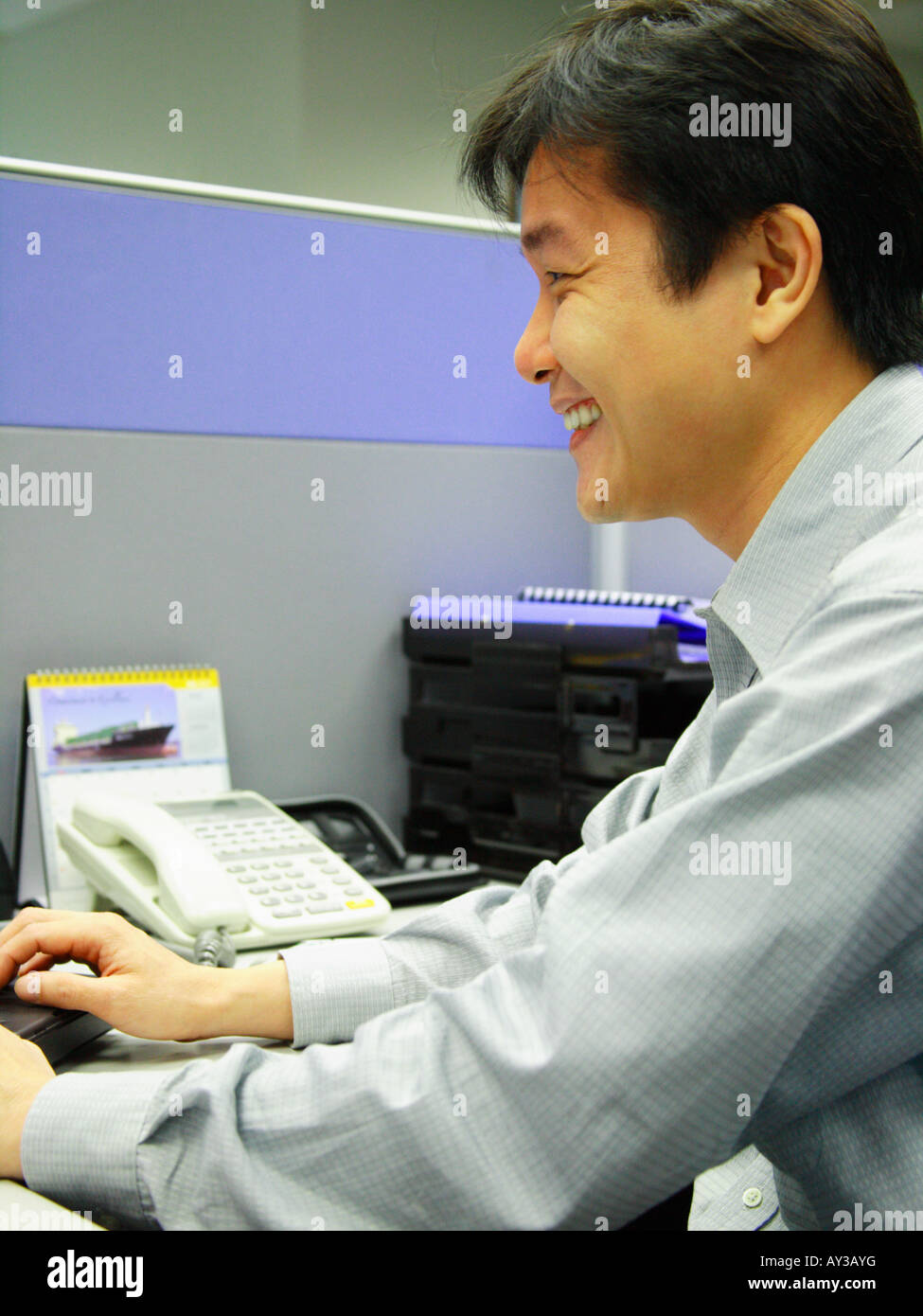 Side profile of a businessman working in an office Stock Photo - Alamy