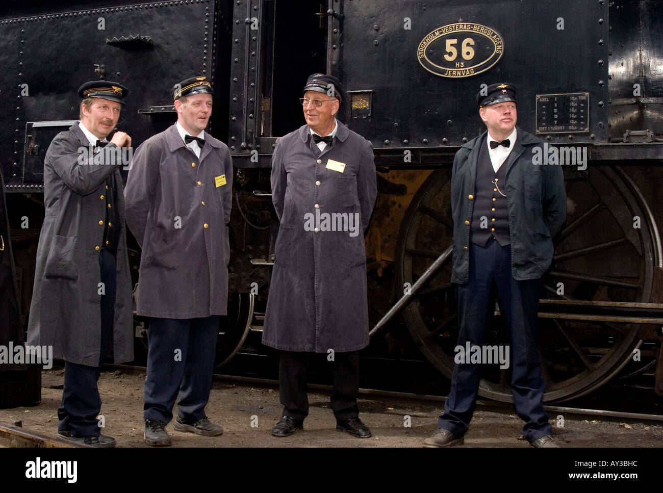 Men and steam engine Stock Photo - Alamy