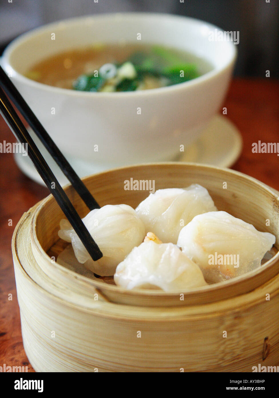 Man eating Chinese food with chopsticks Stock Photo - Alamy