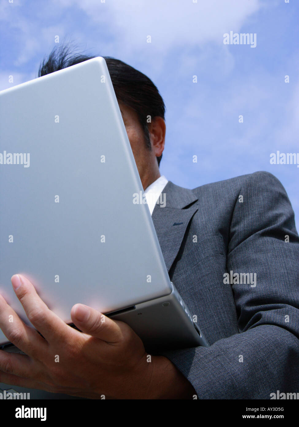 Low angle view of a businessman using a laptop Stock Photo - Alamy