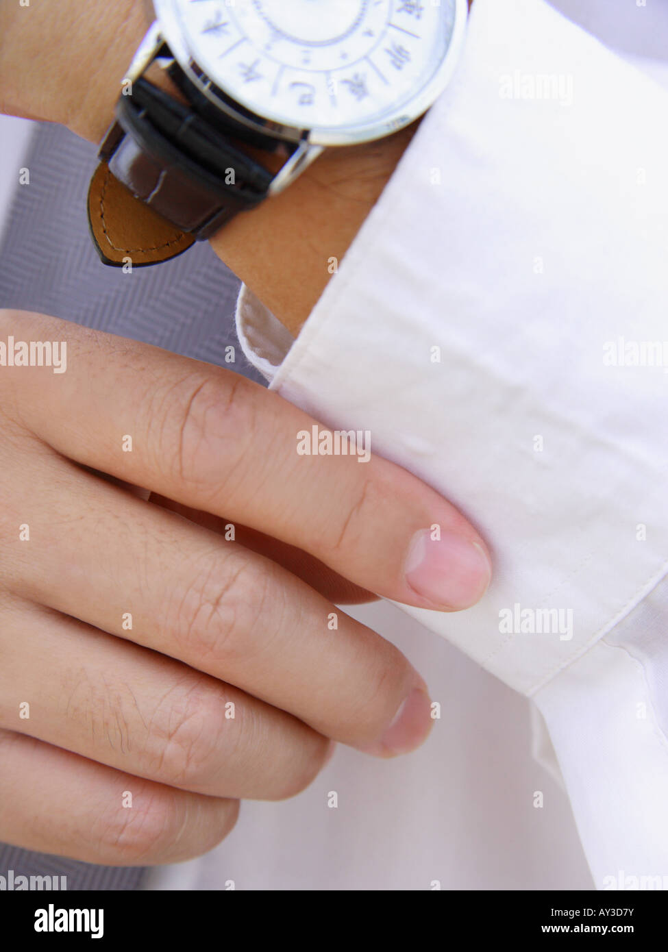 Close-up of a Chinese wristwatch on a person's hand Stock Photo - Alamy