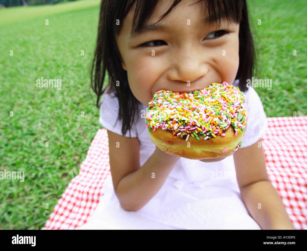 Girl eating a donut hi-res stock photography and images - Alamy