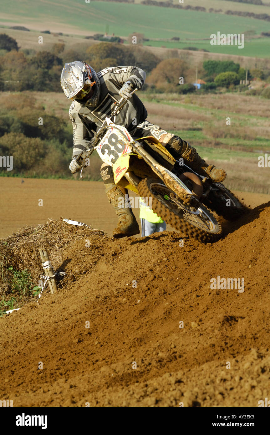 a guy rider on a motocross bile motorcycle jumping and racing big air ...