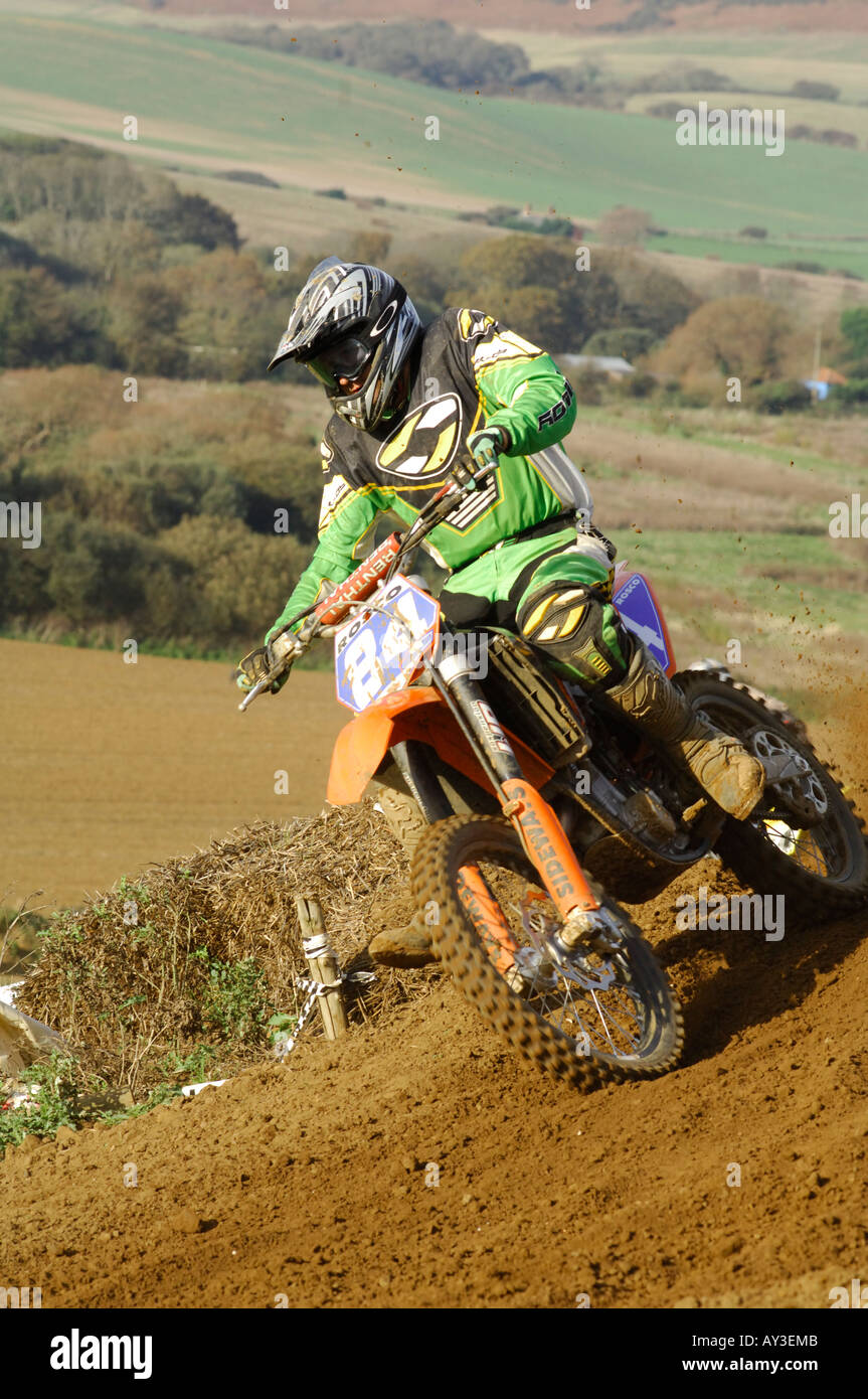 a guy rider on a motocross bile motorcycle jumping and racing big air ...