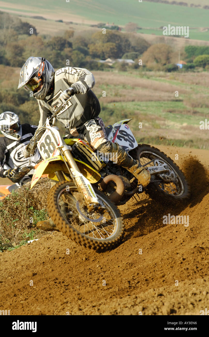 a guy rider on a motocross bile motorcycle jumping and racing big air ...