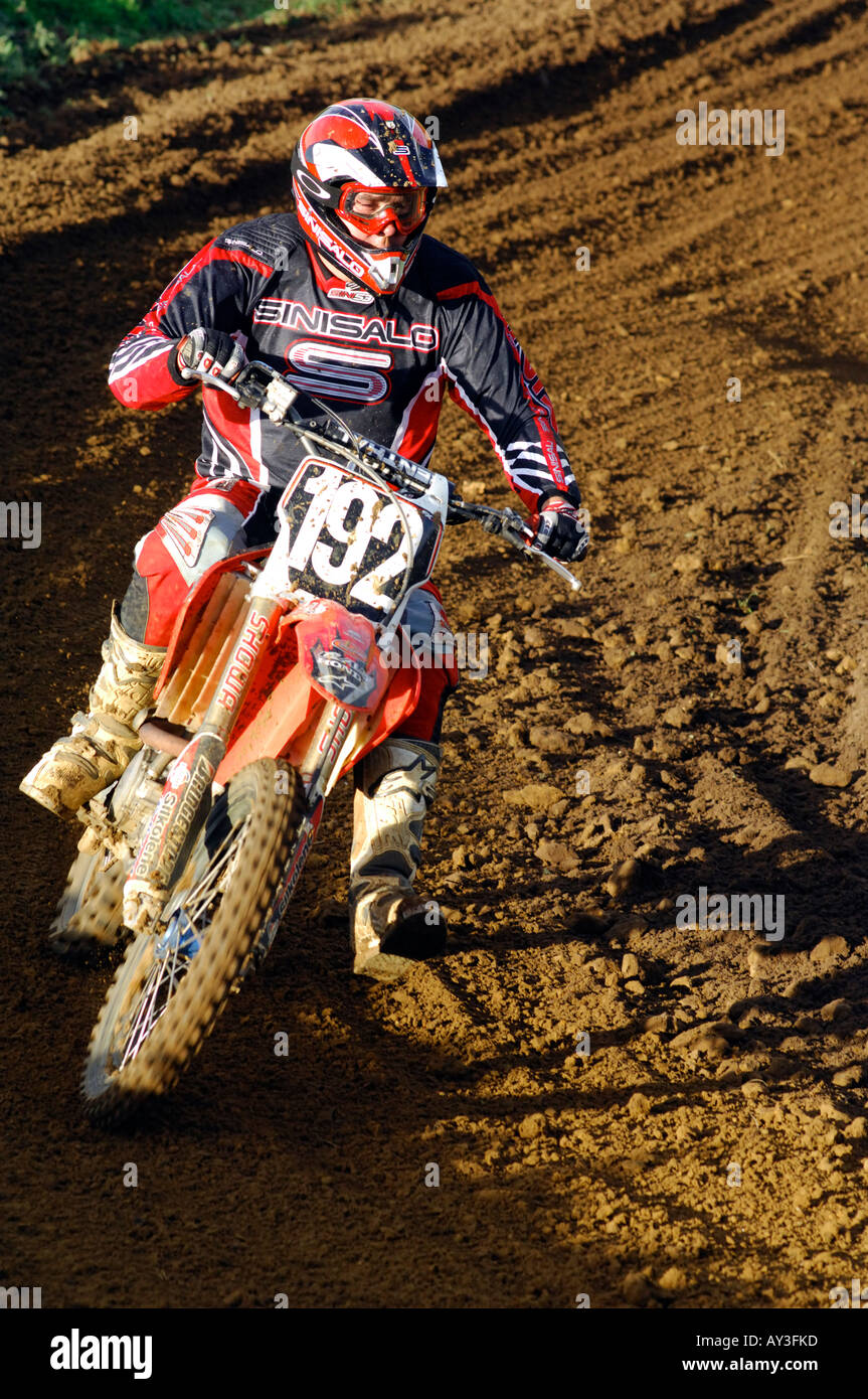 a guy rider on a motocross bile motorcycle jumping and racing big air ...