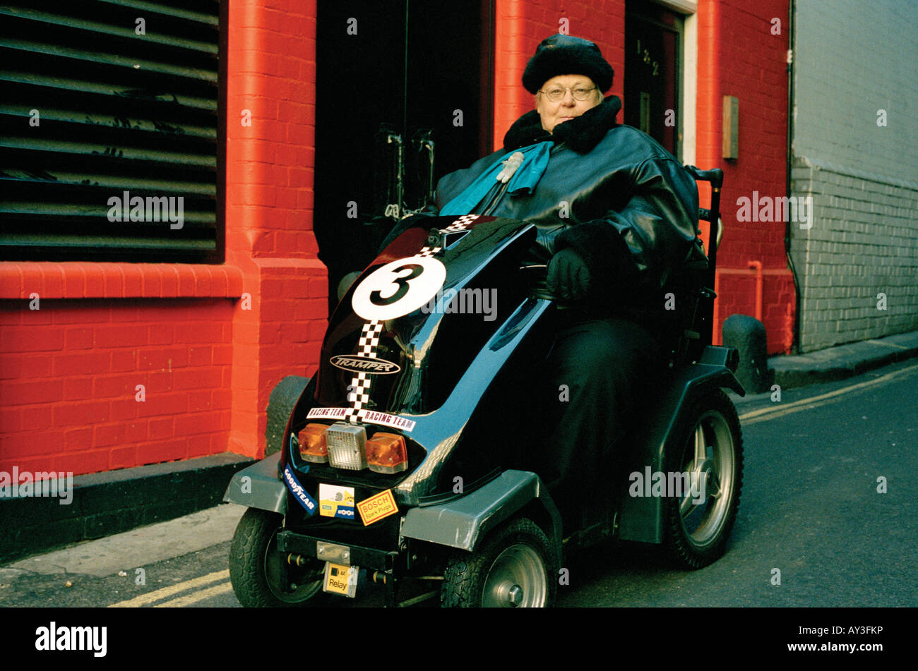 Disabled woman in a customized mobility scooter Stock Photo - Alamy