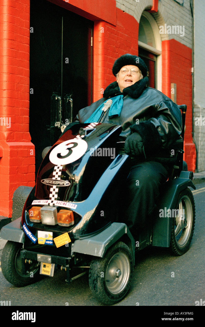 Disabled woman in a customized mobility scooter Stock Photo - Alamy