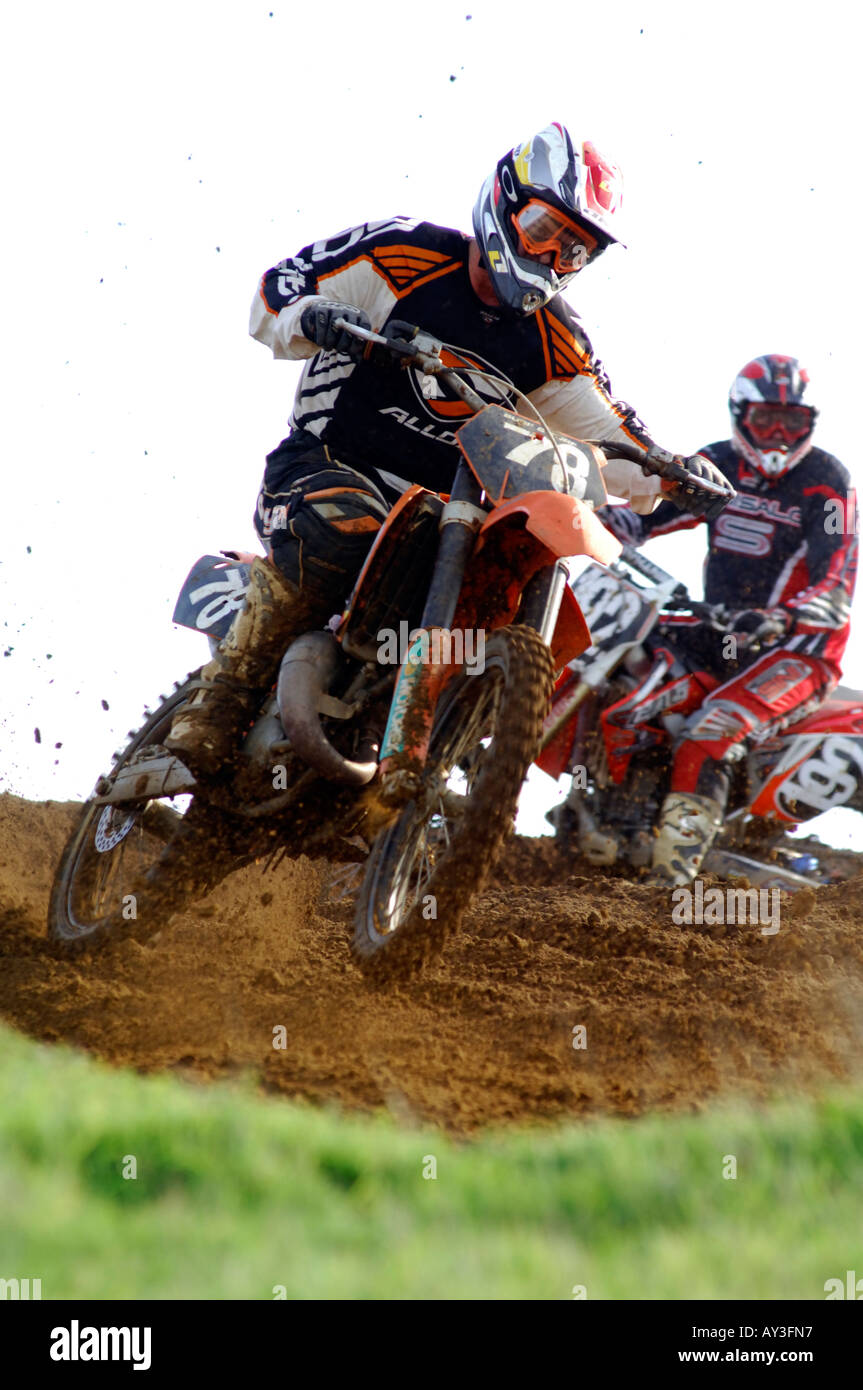 a guy rider on a motocross bile motorcycle jumping and racing big air ...