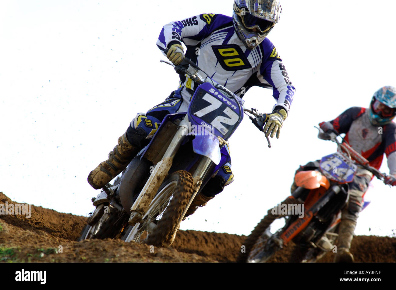 a guy rider on a motocross bile motorcycle jumping and racing big air ...