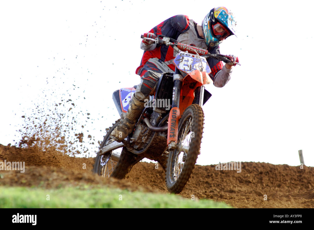 a guy rider on a motocross bile motorcycle jumping and racing big air ...