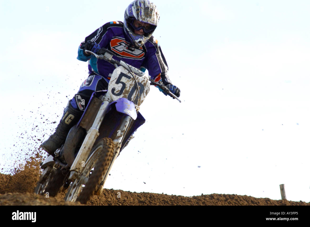 a guy rider on a motocross bile motorcycle jumping and racing big air ...