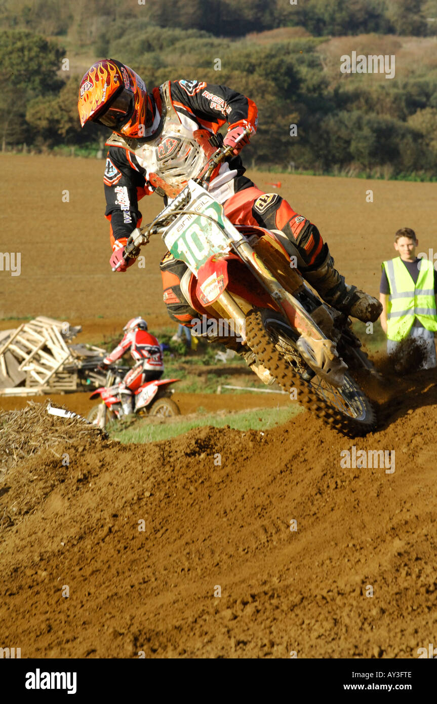 a guy rider on a motocross bile motorcycle jumping and racing big air ...