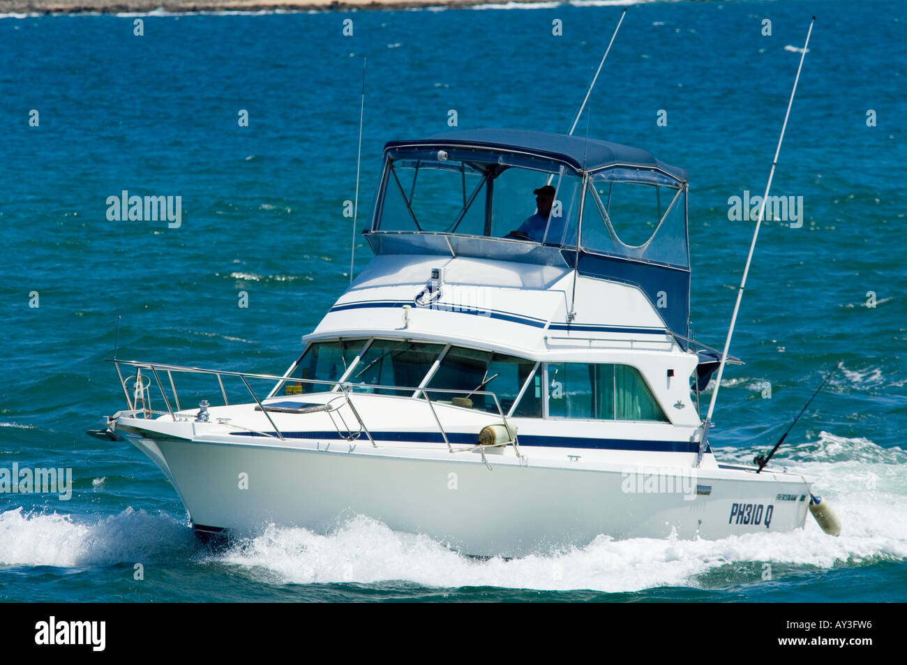 Game fishing boat returning to port Stock Photo - Alamy