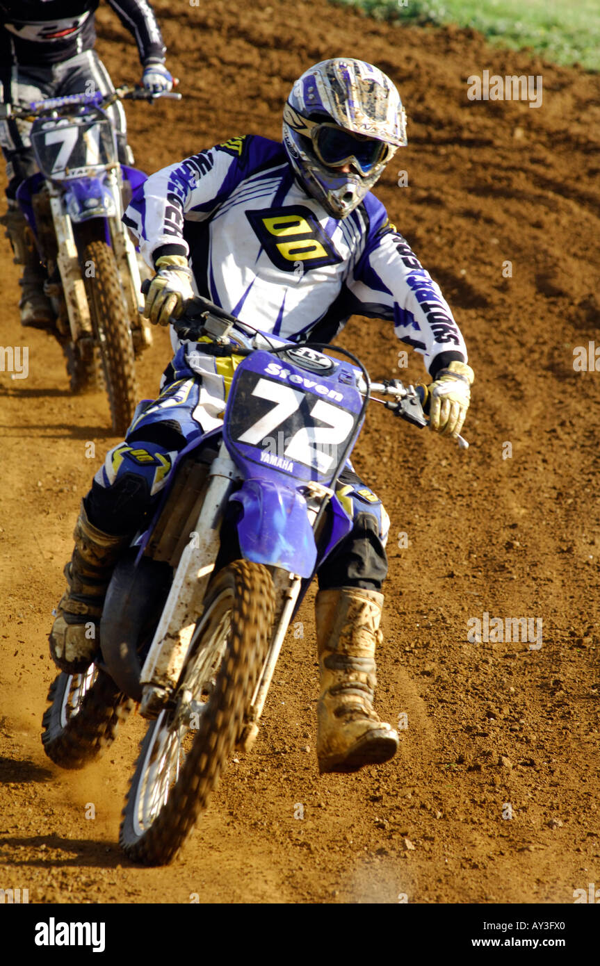 a guy rider on a motocross bile motorcycle jumping and racing big air ...